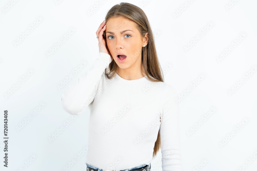 Embarrassed Young beautiful woman with shocked expression, expresses ...
