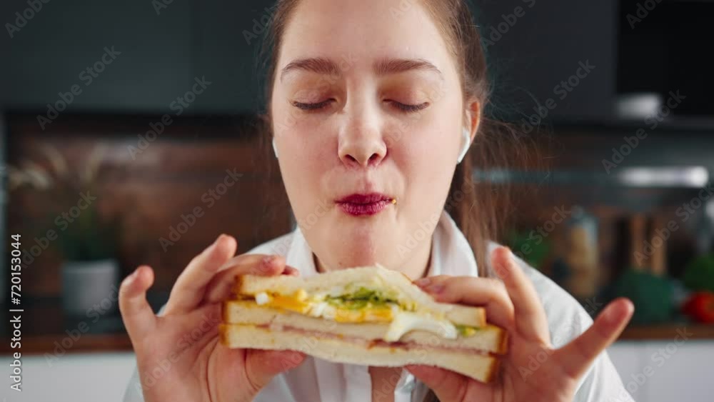 Woman eating fast food sandwich. Hungry girl eating fast food unhealthy ...