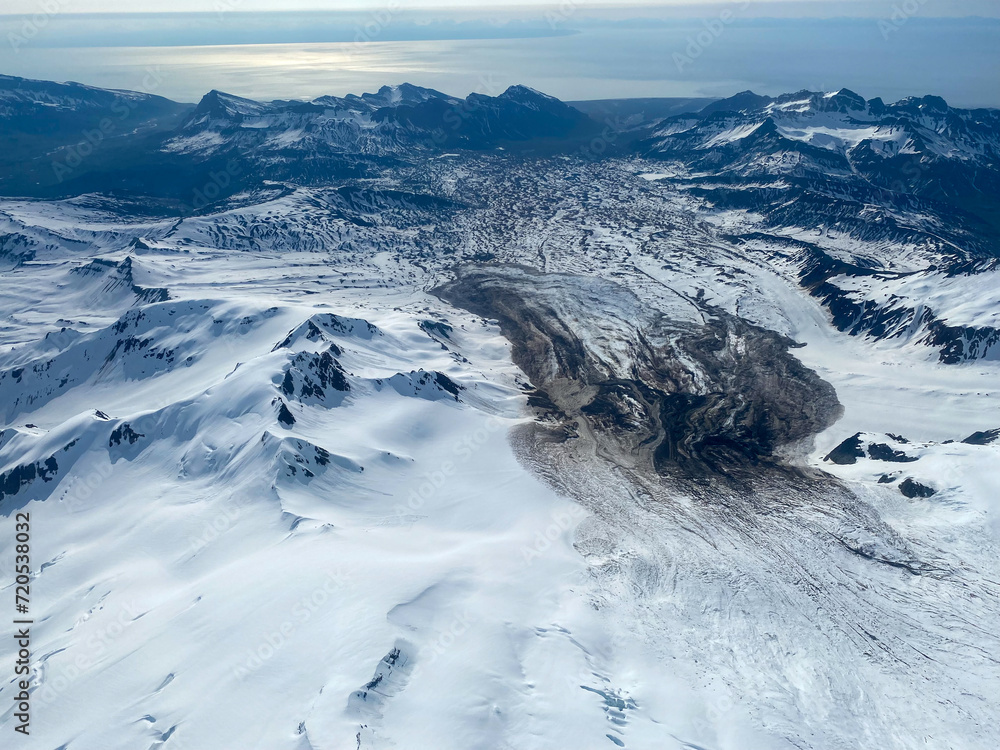 A glacier flows towards the Cook Inlet from Mount Iliamna at Lake Clark ...