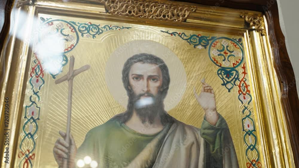 Iconic painting of Jesus Christ holding a cross, with a gilded halo ...