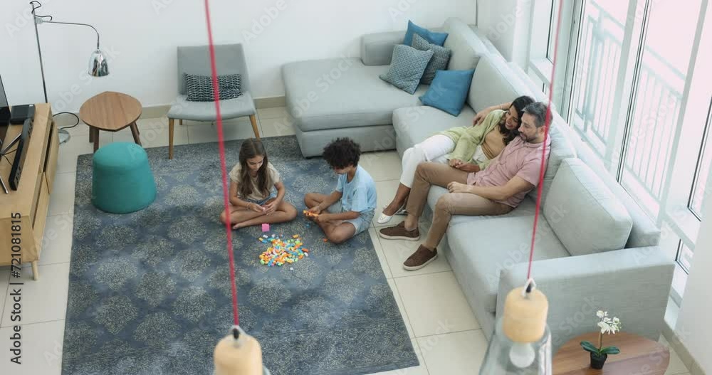 Happy middle aged mom and dad watching little preteen sibling children ...