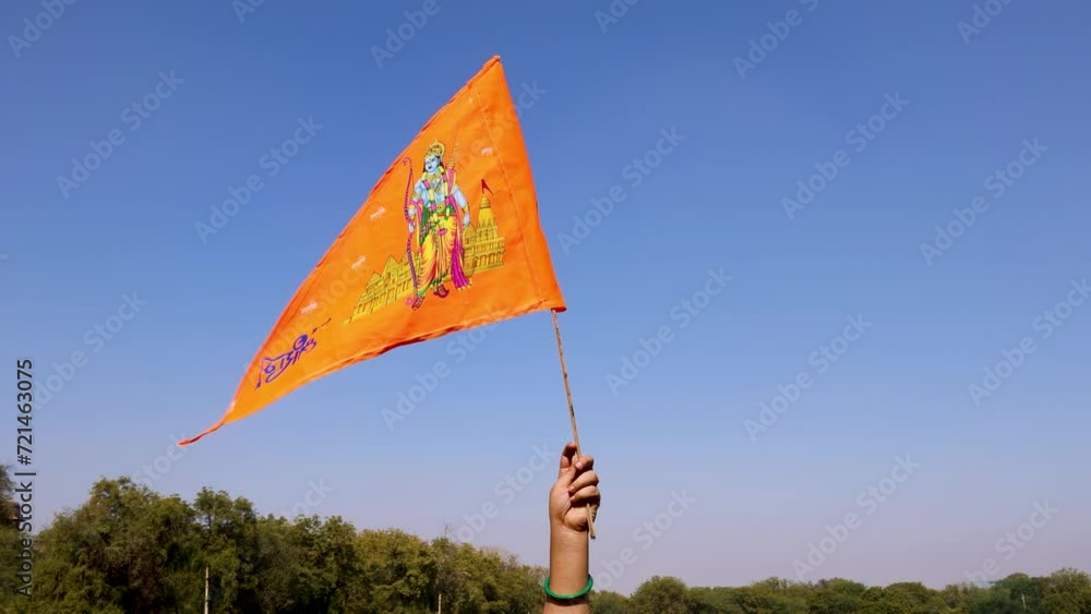 Vidéo Stock holy saffron flag with lord rama idol holing in hand with ...