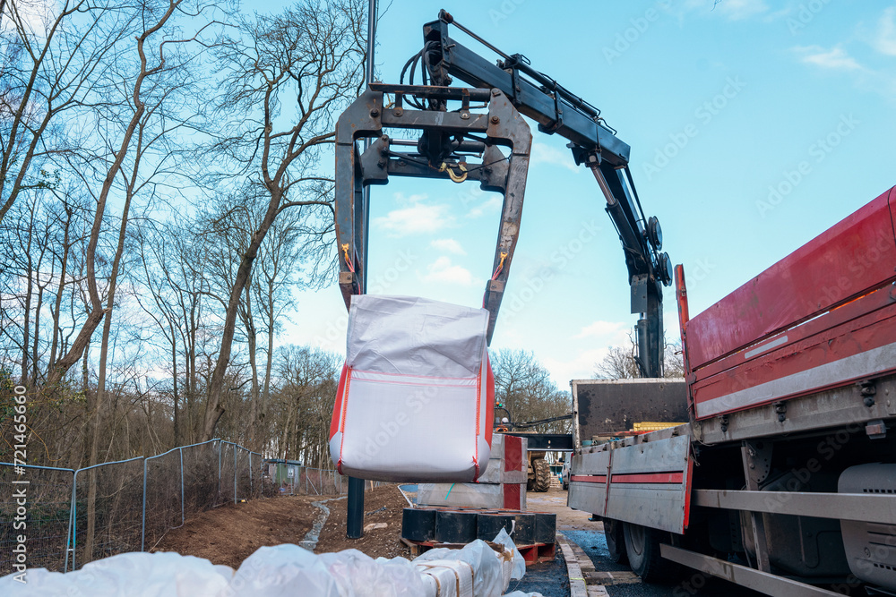 Dropside flatbed HIAB crane lorry with brick grab attachment deliver ...