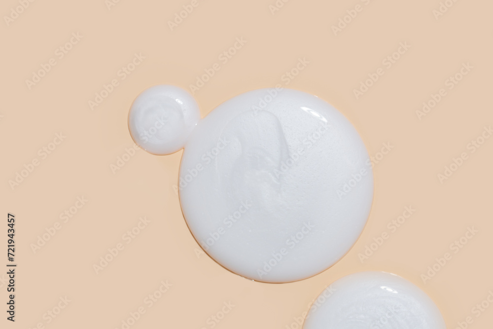 Cosmetic product smear white moisturizing lotion isolated on beige ...