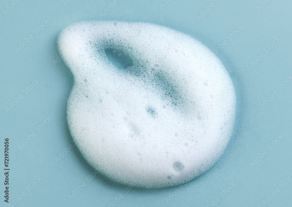 Foam smudge on blue background. Liquid soap bubbles, Froth bubbles ...