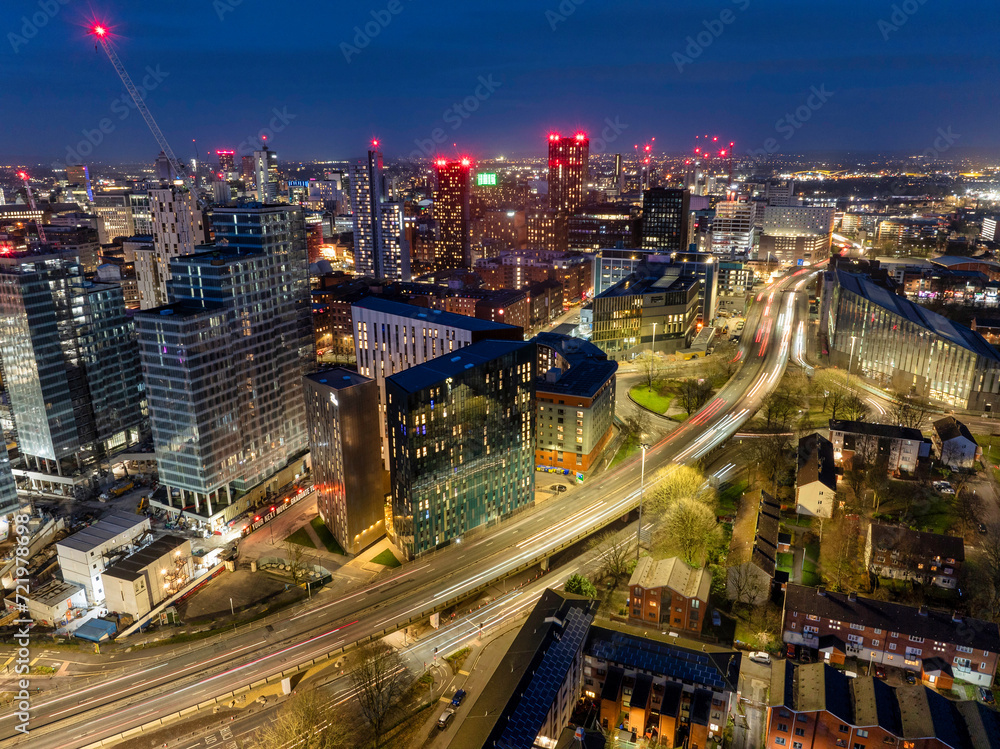 Aerial image of Manchester skyline early night showing new urban ...