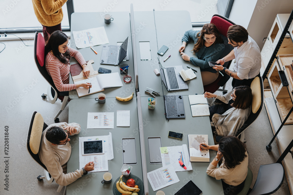 Coworkers collaborate and work together in a modern office. They ...