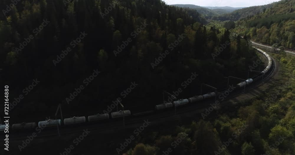 Freight long train carries with oil tank and petrol carriages an ...