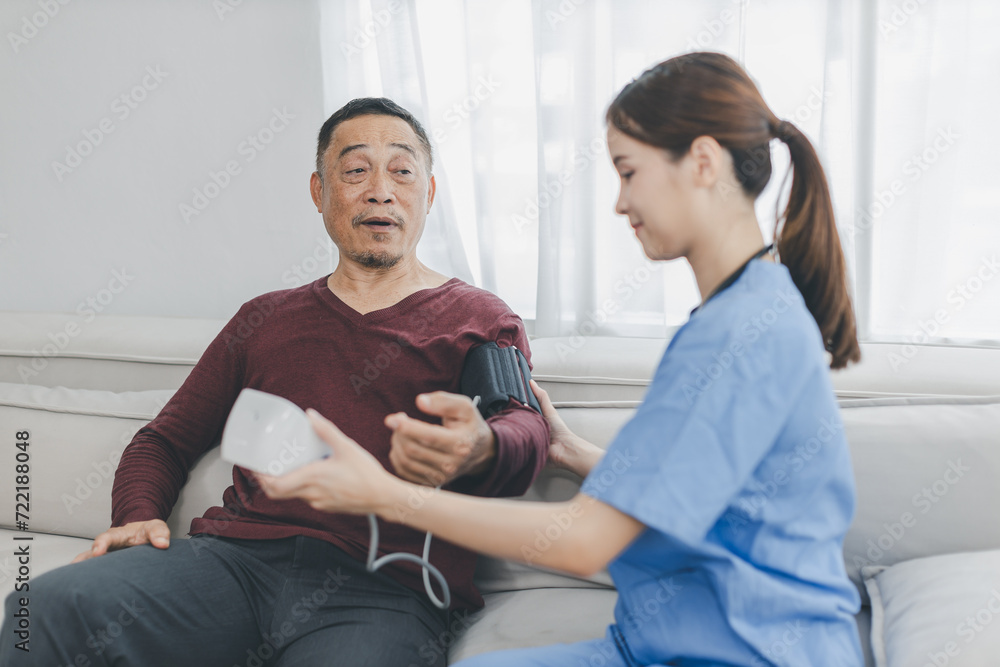 Foto de Caregiver nurse measuring blood pressure by using digital ...