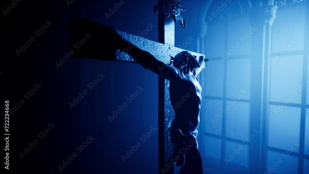 Cross with the crucifixion of Jesus Christ in the night, backlight in a ...