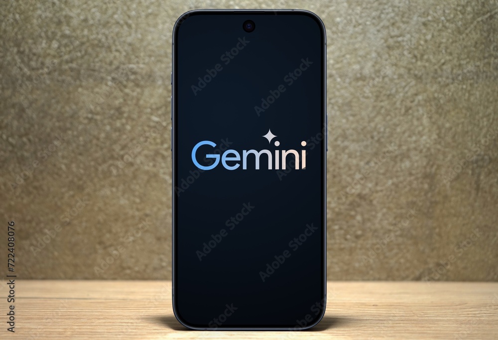 Gemini Logo shown on a modern smartphone standing on a wooden desk ...