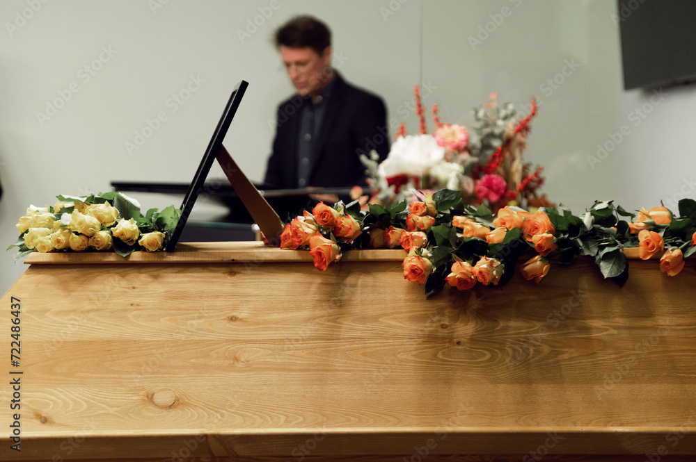the priest conducts the funeral service. hard times. funeral service ...