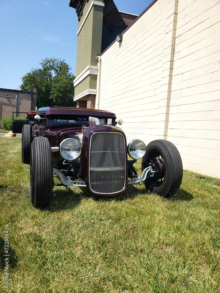 Customized classic lowrider hot rod roadster with exposed engine, big ...