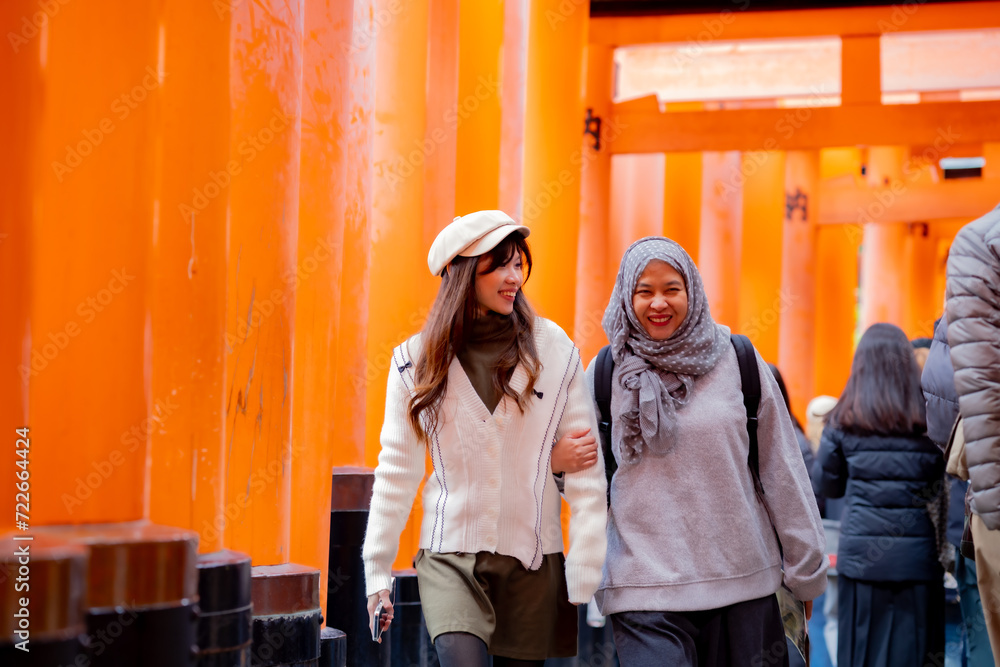 Travel, muslim, Two Asian female tourists of different religions ...