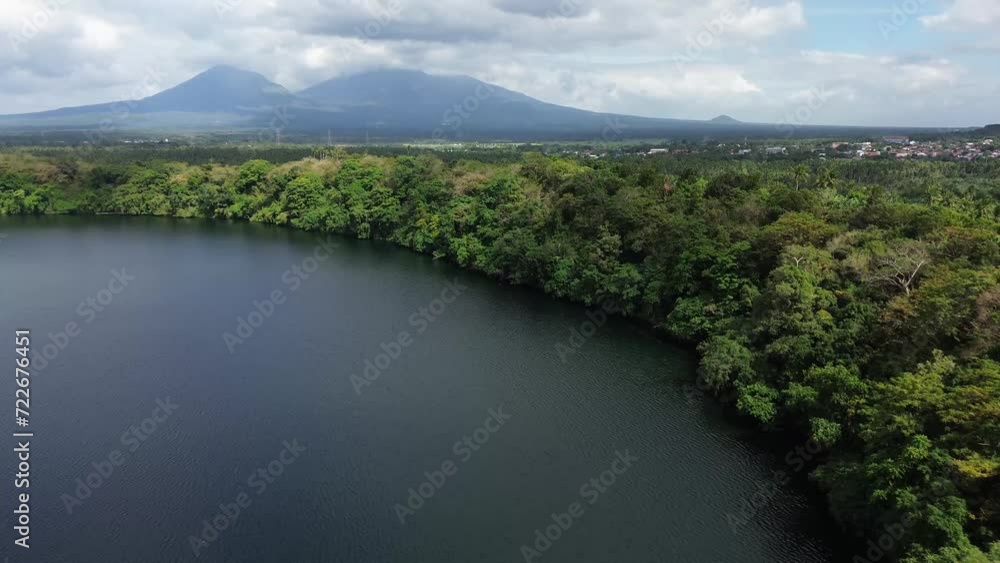 Secluded lake, surrounded by dense forest, remains inaccessible to the ...