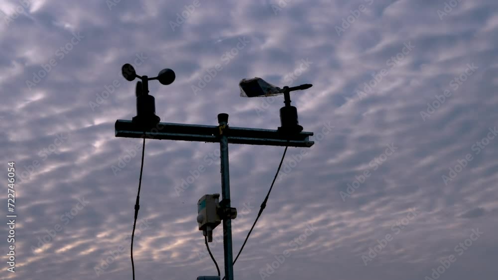 Silhouette of anemometer cup on cloudy sky background, old and rusty ...