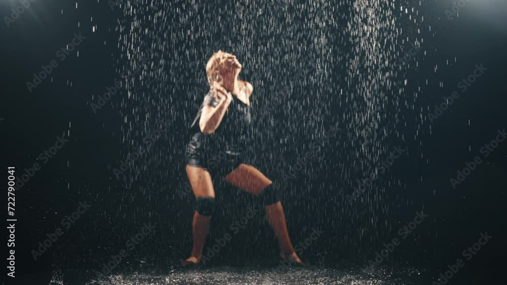 Vidéo Stock Happy woman dances under rain in studio. Beautiful sensual ...