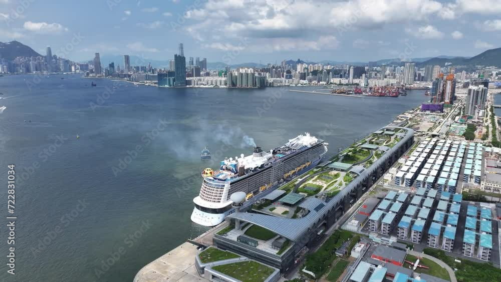 Drone Aerial Skyview of a Mega Luxury Cruise Ship is docking at the Kai ...
