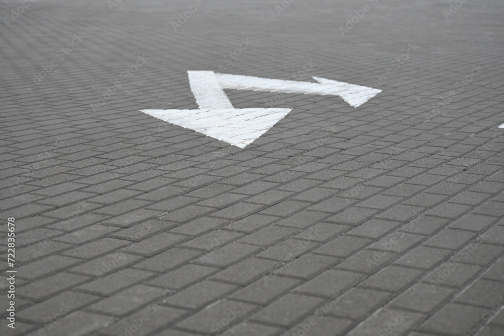 white arrow on gray asphalt, turn left, turn right, abstract white ...