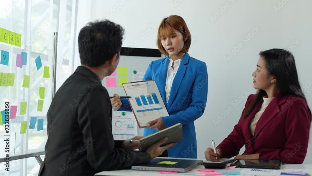 A team of young Asian businessmen and marketing staff Accounting and ...