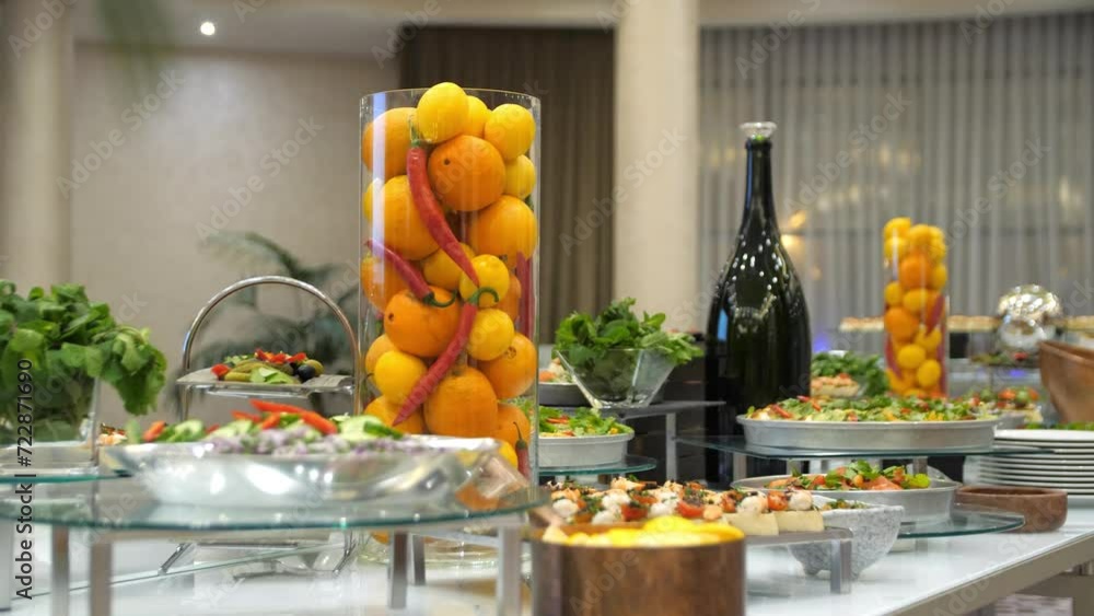 Close-up of a buffet table with canapes, vegetables and herbs on ...