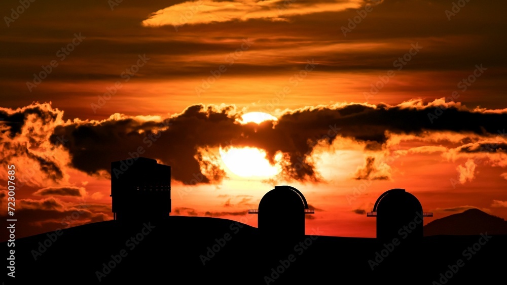 Cosmos satellite station with telescope observatories over sunset ...