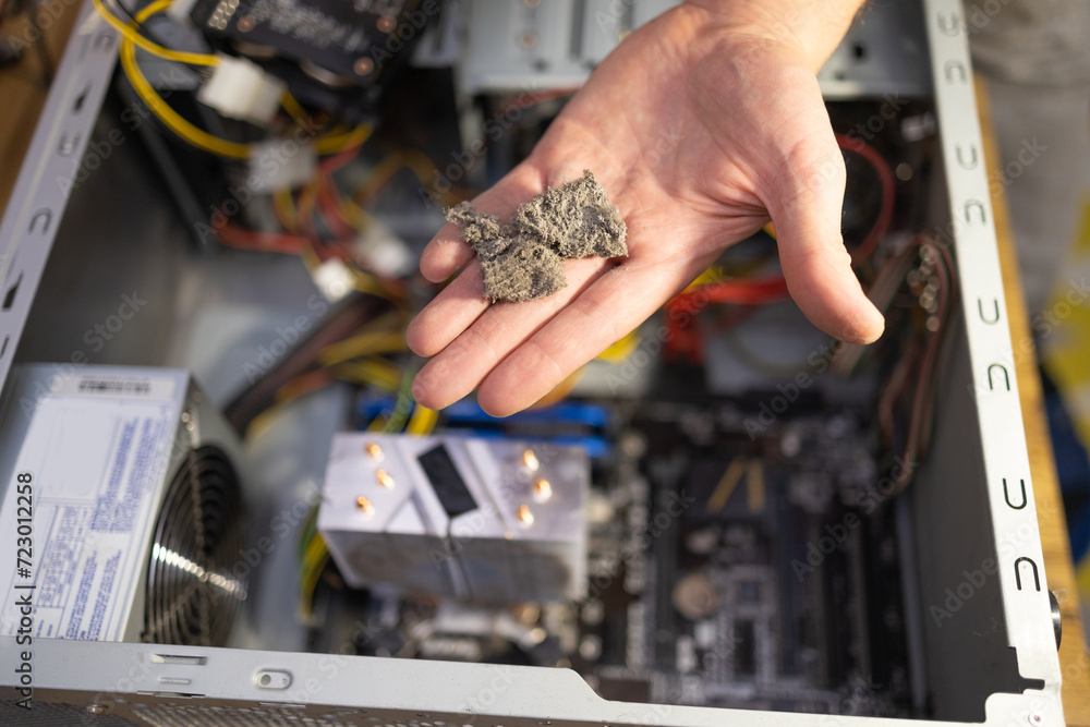 Cobwebs and dust sway in the wind in a computer case against the ...
