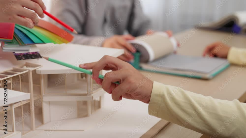 Slow motion home designer using architectural equipment draw a ...