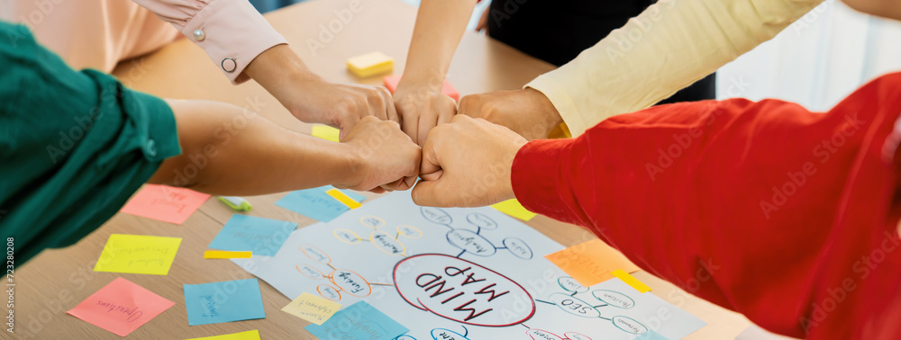 Young happy creative startup group join circle fist bump hands together ...