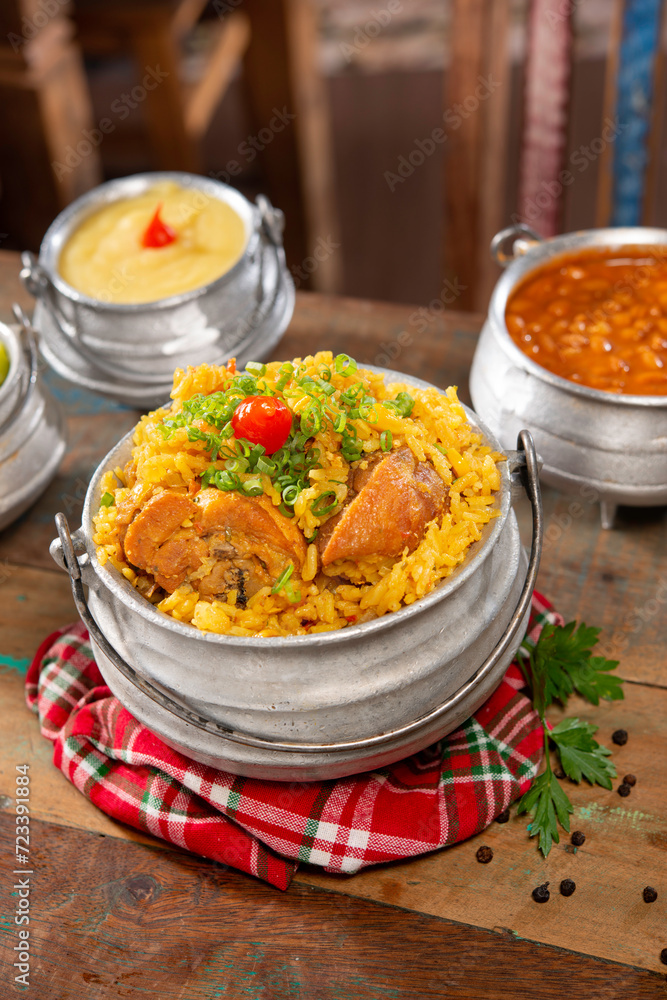 typical brazilian dish ( galinhada ) with curcuma seasoned, chicken and ...