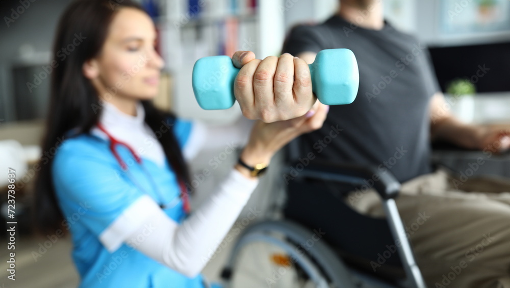 Man on stroller doing exercises with dumbbells. Simple exercises for ...