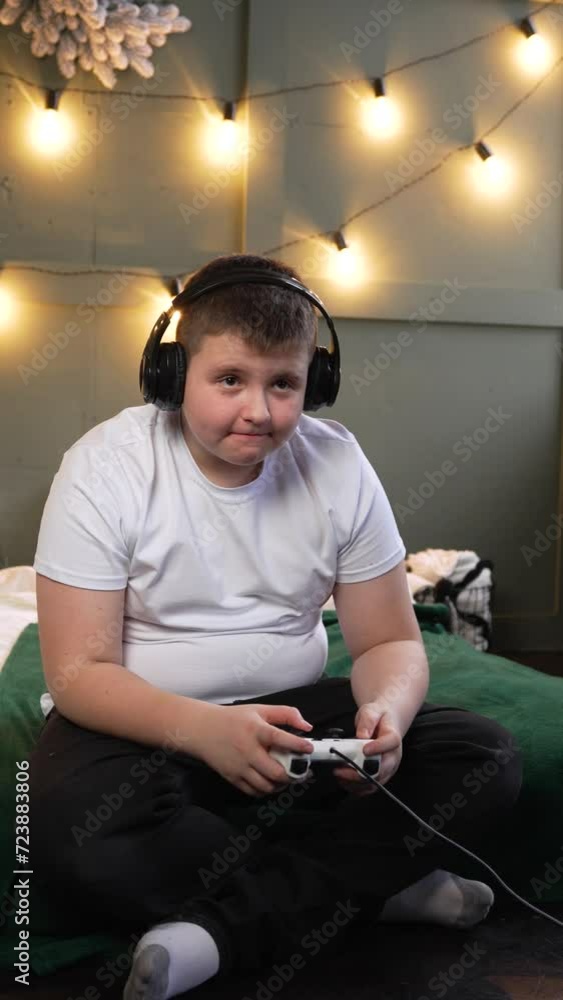 Vertical screen: Man gamer hands holding modern console for play ...