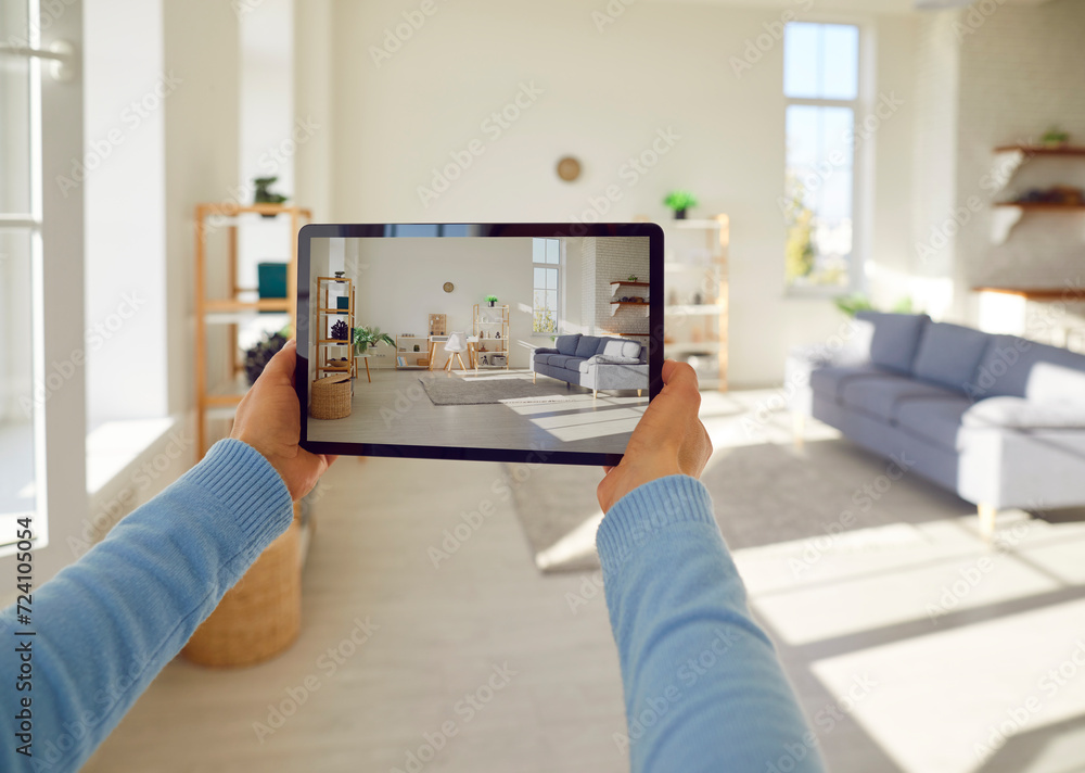 Hands holding device, taking room interior design picture with tablet ...