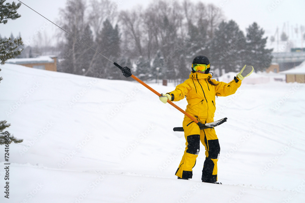 Ski resort. Single satisfied snowboarder on T-bar with a crossbar ...