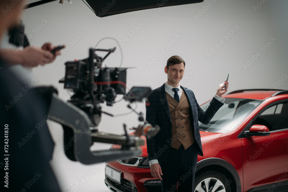 Professional male actor works in the frame on the set. Shooting with a ...