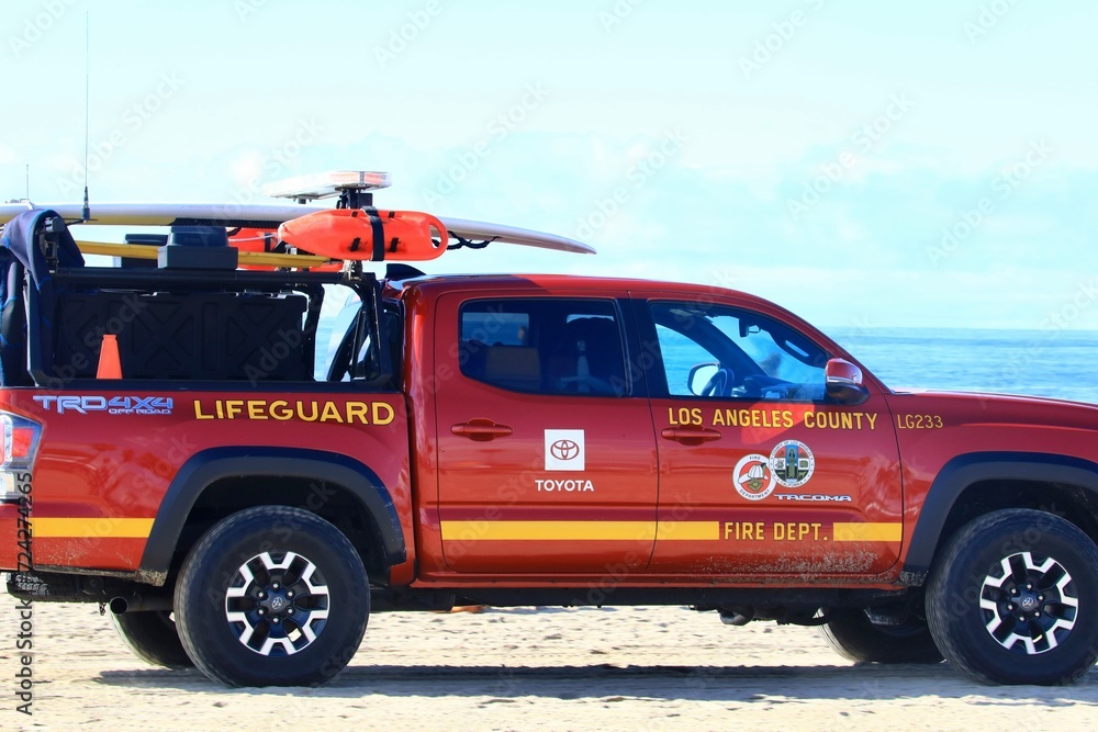 Lifeguard surveillance and rescue vehicle. Pickup truck patrolling the ...