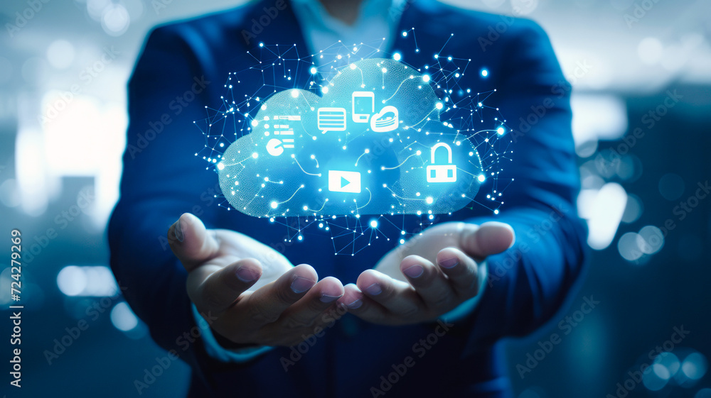 An entrepreneur navigates computer icons in the cloud, holding a ...