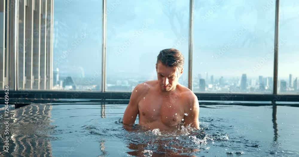 Man calls phone in luxury hotel pool on vacation. Shirtless tourist ...