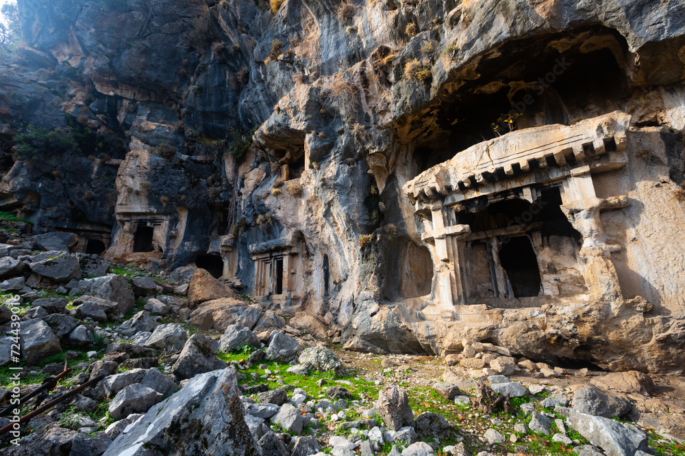 View of antique rock burial chambers in ancient Lycian city of Pinara ...