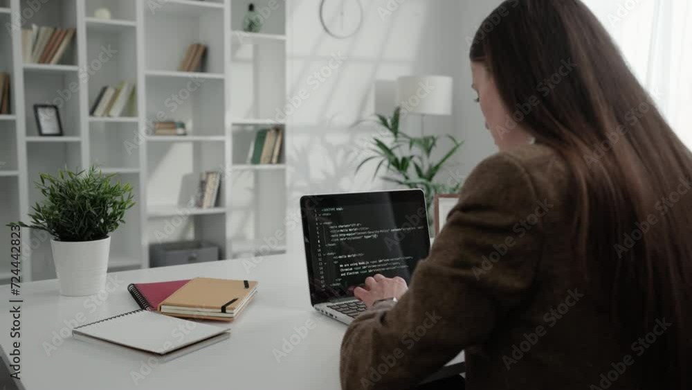 Back View of the Brunette Girl Sitting in the Home Office and ...