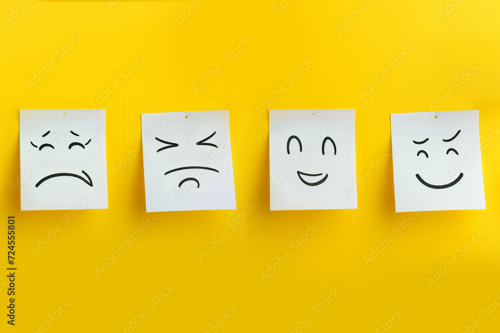 Testimonial rating concept with emotion faces on colorful sticky notes ...