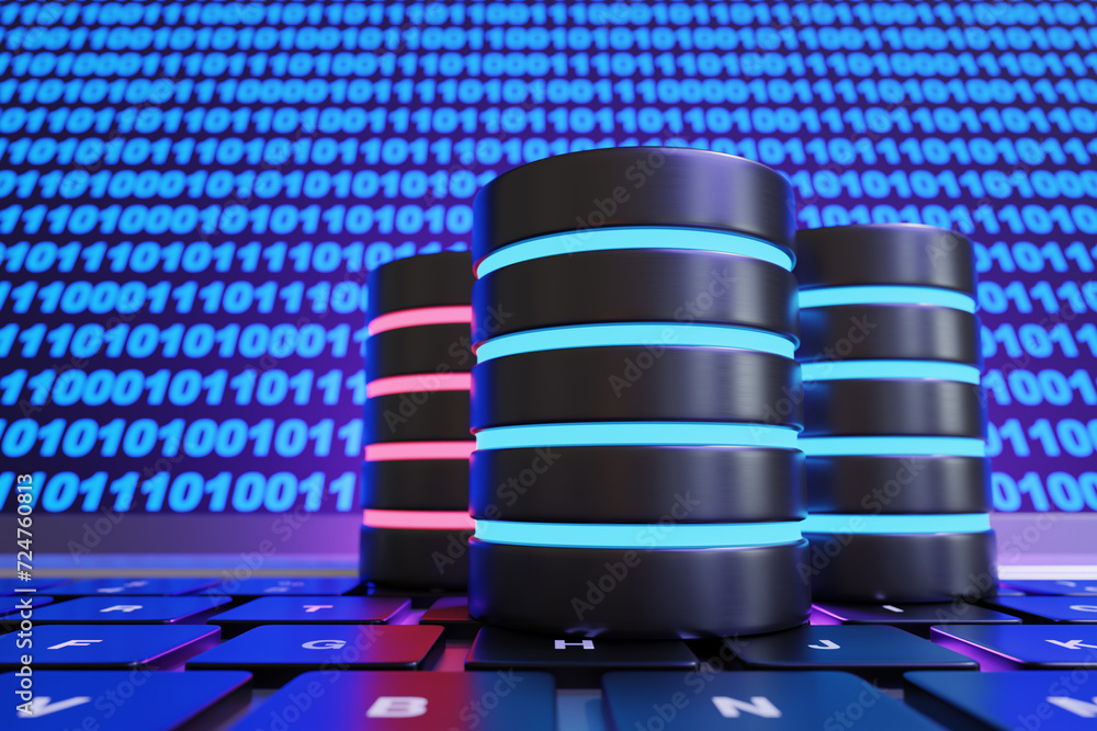Neon glowing cylindrical database symbols standing on the keyboard of a ...