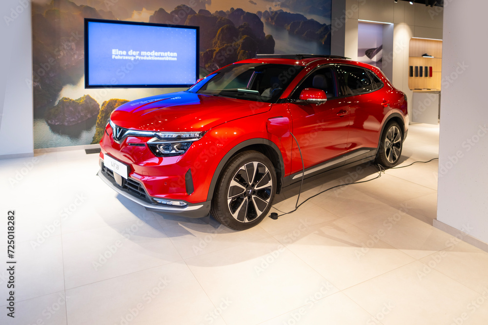 new red Vinfast electric crossover in showroom, trends EV in Europe ...
