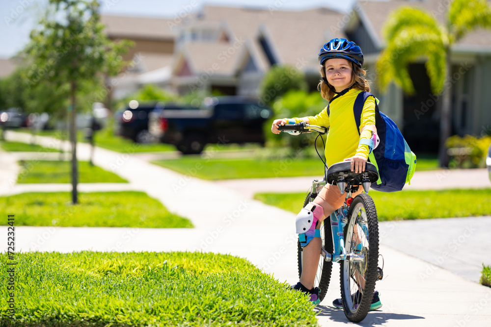 Little kid boy ride a bike in the park. Kid cycling on bicycle. Happy ...