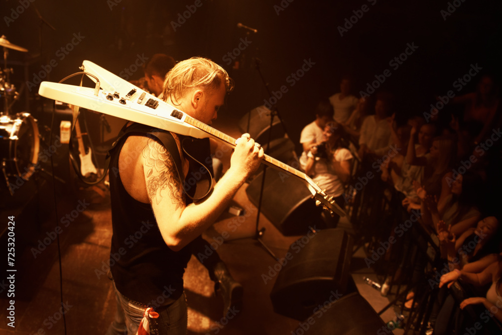 Guitar, musician and stage concert at night with man in performance of ...