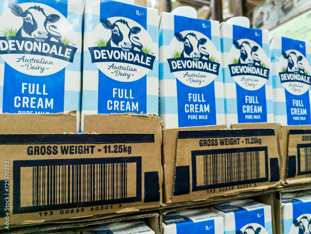 Rows of Devondale full cream milk cartons in cardboard boxes, ready for ...