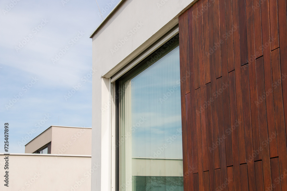 House facade with glass window and wood cladding modern architecture ...