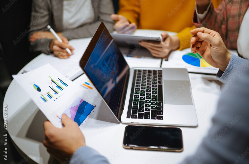 Office work. Young entrepreneurs collaborating on a new project in a ...