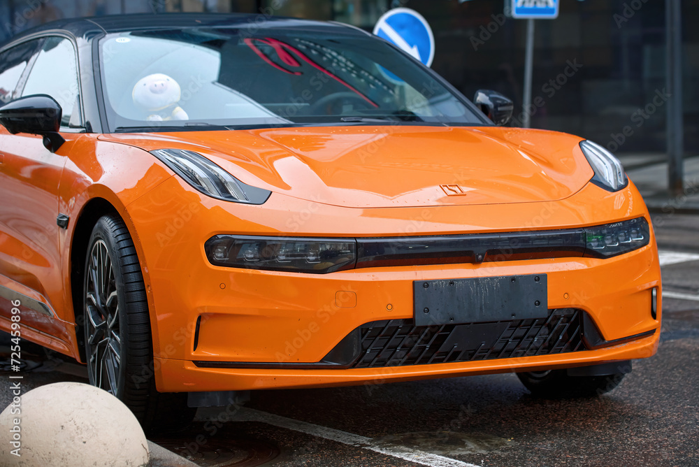 Minsk, Belarus. Dec 17, 2023. Orange Zeekr 001 parked on roadside at ...