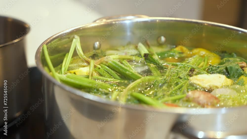 Vídeo do Stock: Close up of vegetarian soup cooking from fresh green ...